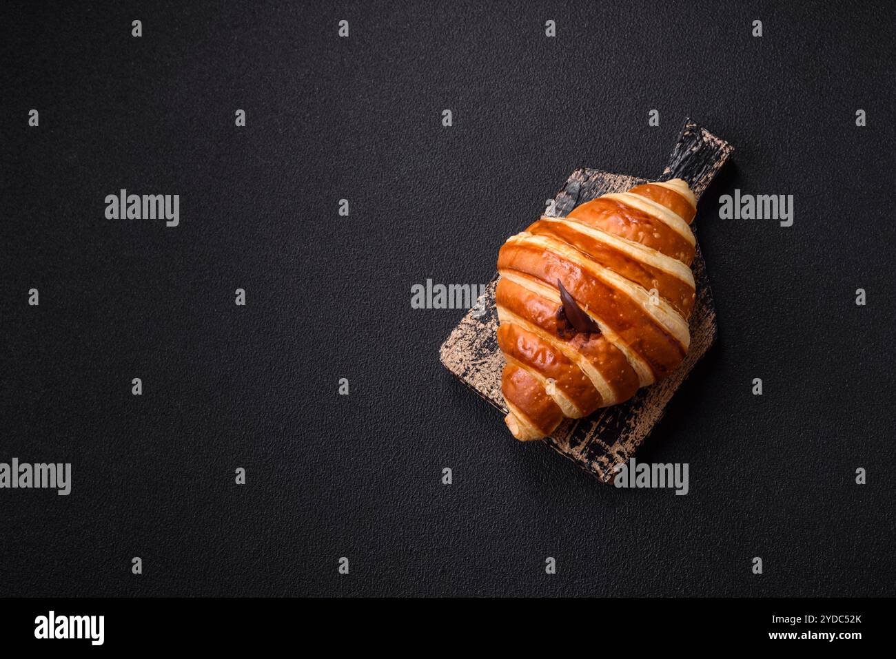 Delicious crispy sweet croissant cornet with chocolate Stock Photo - Alamy