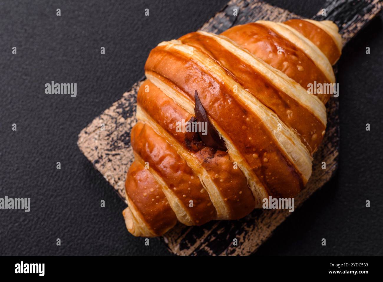 Delicious crispy sweet croissant cornet with chocolate Stock Photo - Alamy