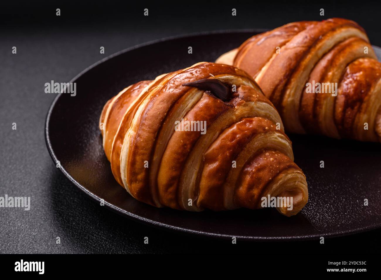Delicious crispy sweet croissant cornet with chocolate Stock Photo - Alamy