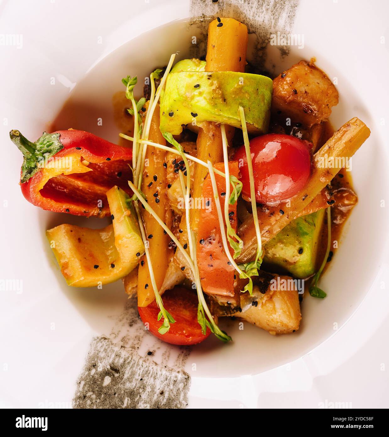 Cod fish baked with vegetables top view Stock Photo - Alamy