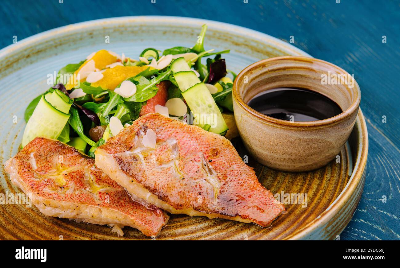 Grilled Red Snapper fish fillets and fresh vegetable salad Stock Photo ...