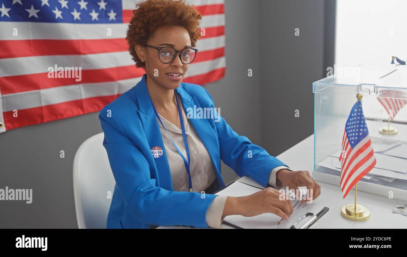 African american woman in a blue blazer voting inside a room with us ...