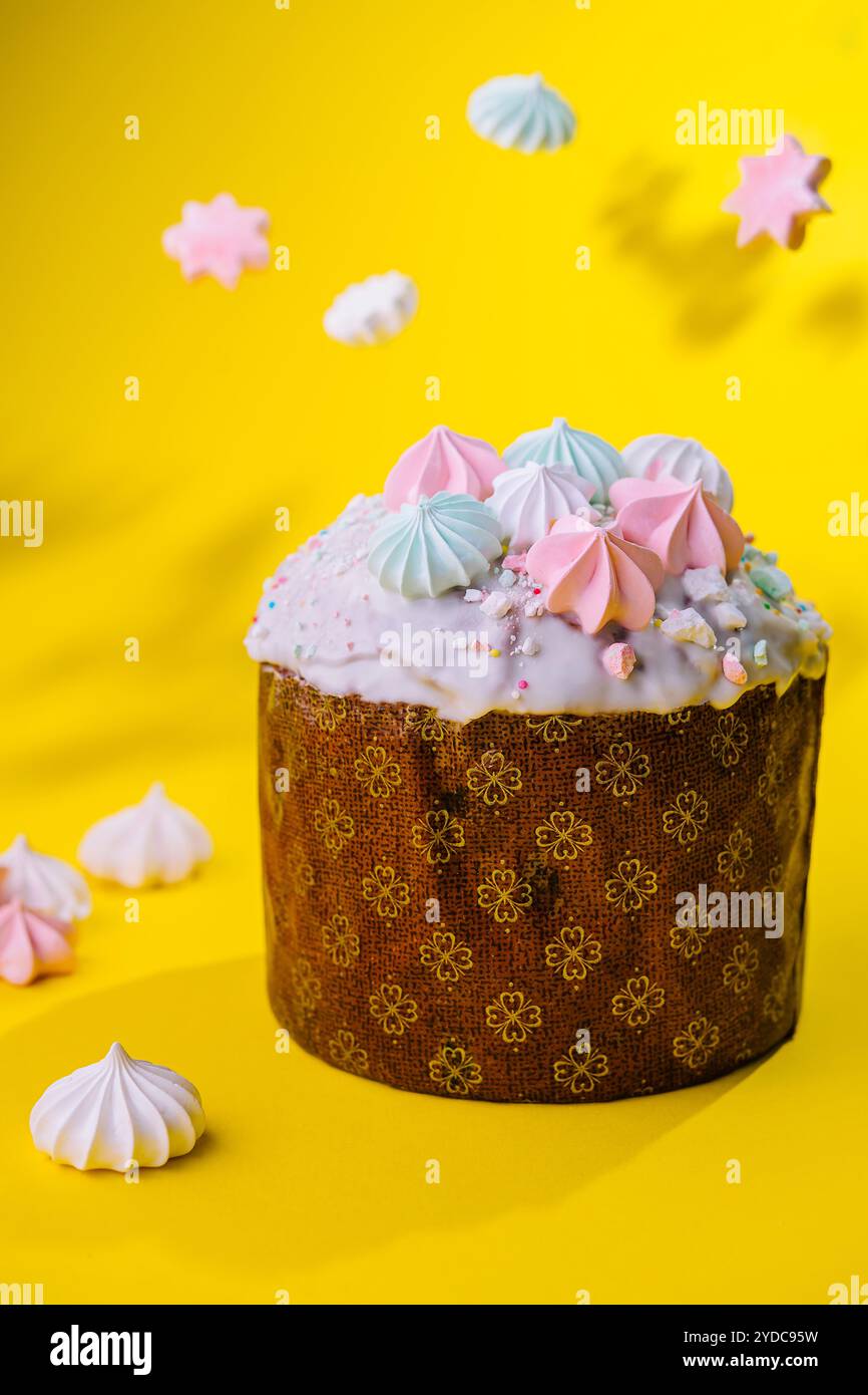 Traditional Easter cakes with meringue on yellow background Stock Photo ...