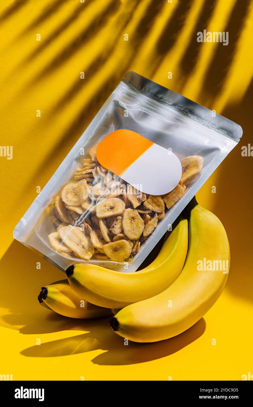 Pack of dried bio organic healthy banana chips Stock Photo - Alamy