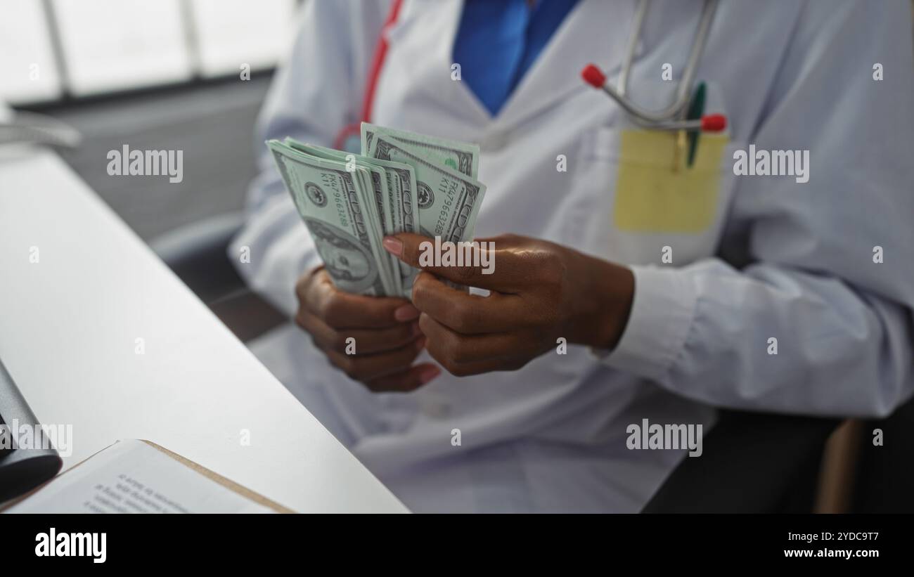 An african american female doctor in a hospital clinic counting u.s ...