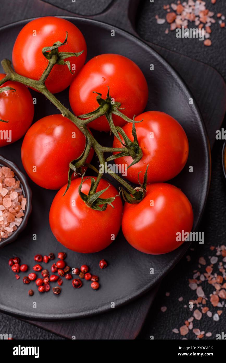 Juicy ripe tomatoes on branch hi-res stock photography and images - Alamy