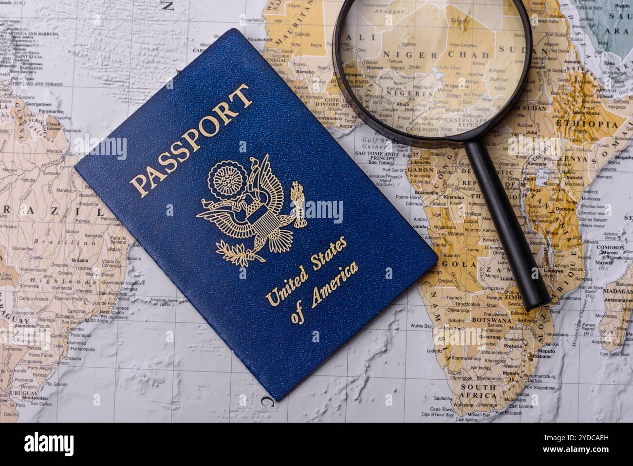 Conceptual background for travel with passport, magnifying glass, world ...