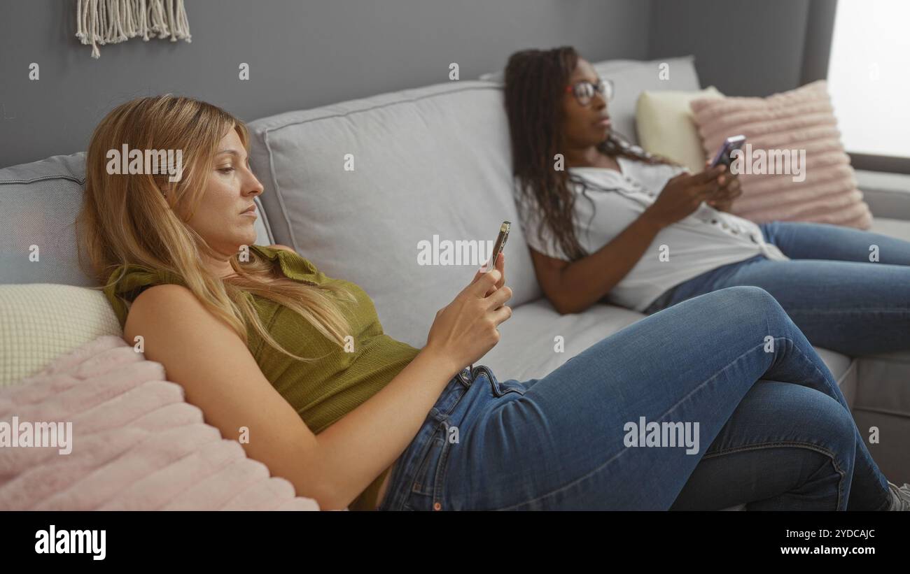 Women chilling on couch hi-res stock photography and images - Alamy