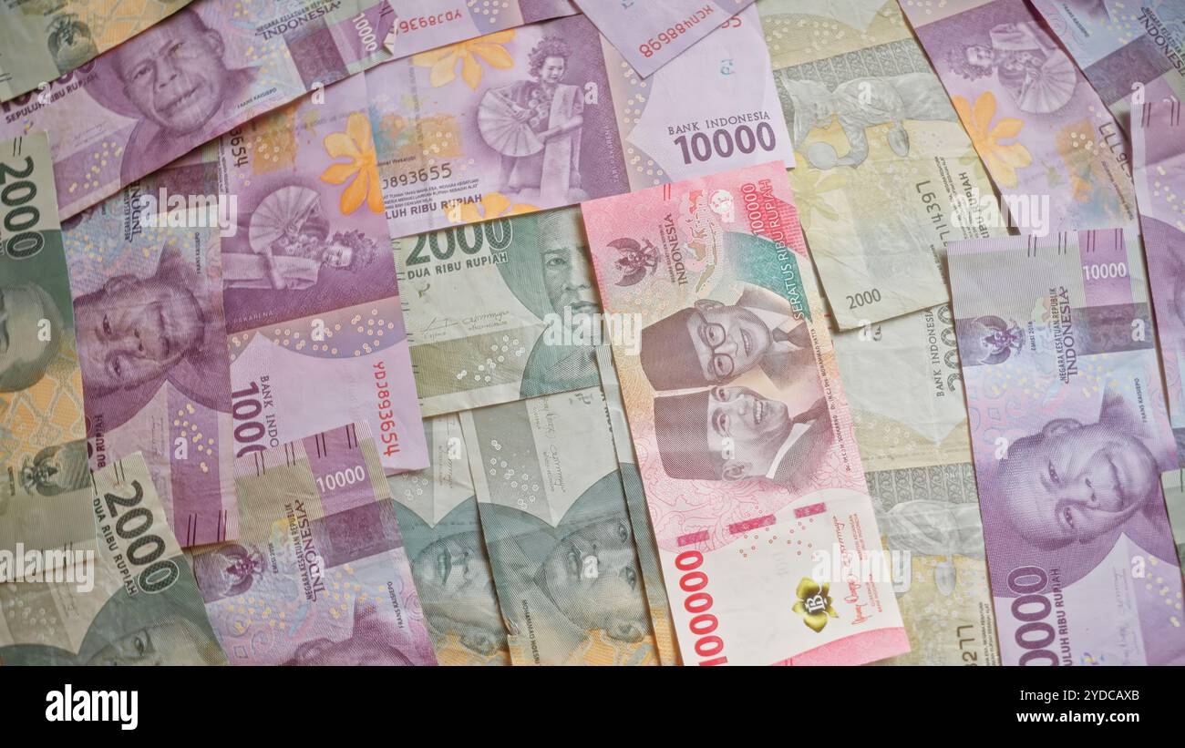 Indonesian banknotes scattered showcasing various denominations of ...