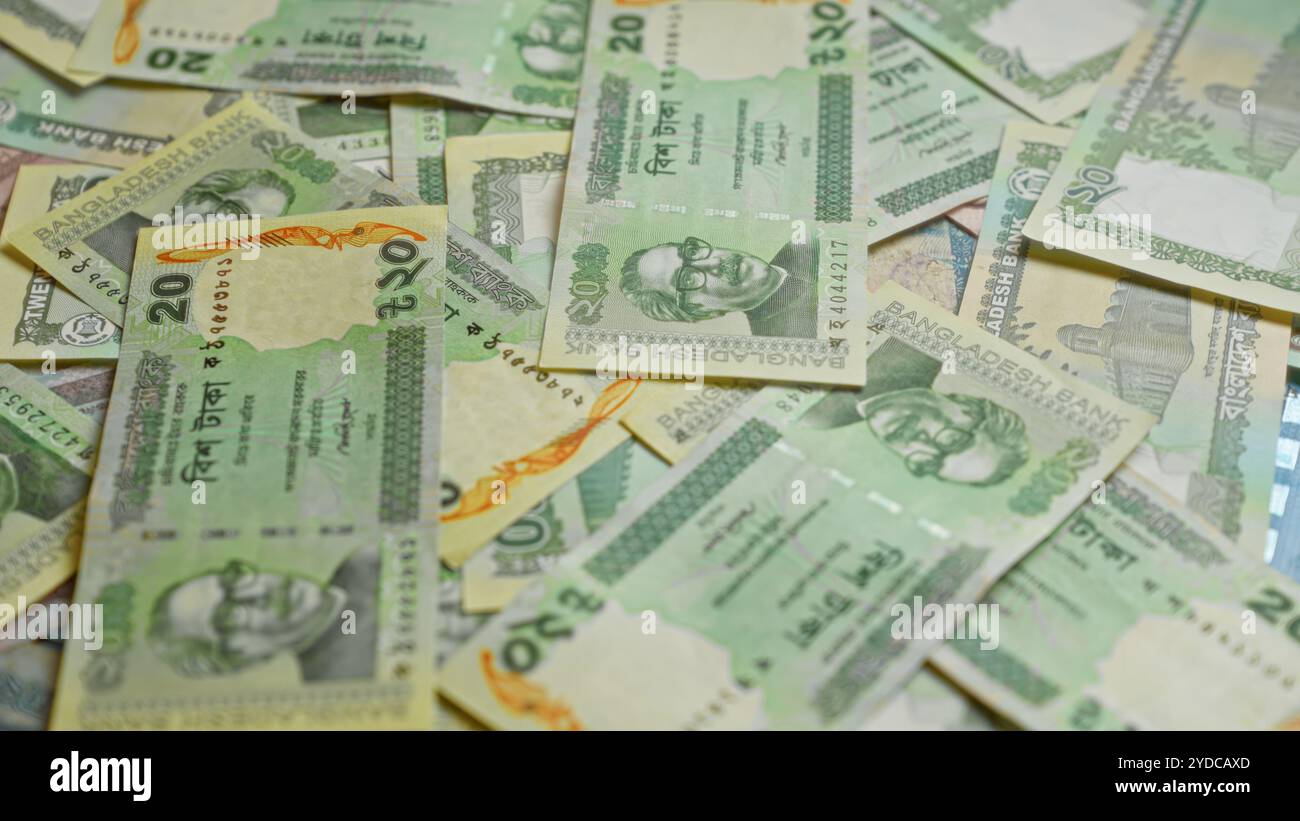 Bangladeshi banknotes scattered on a surface, highlighting various ...