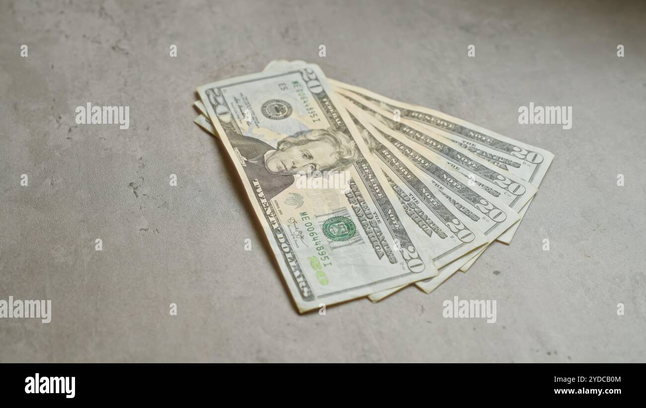 Pile of american dollars banknotes spread on a concrete surface ...