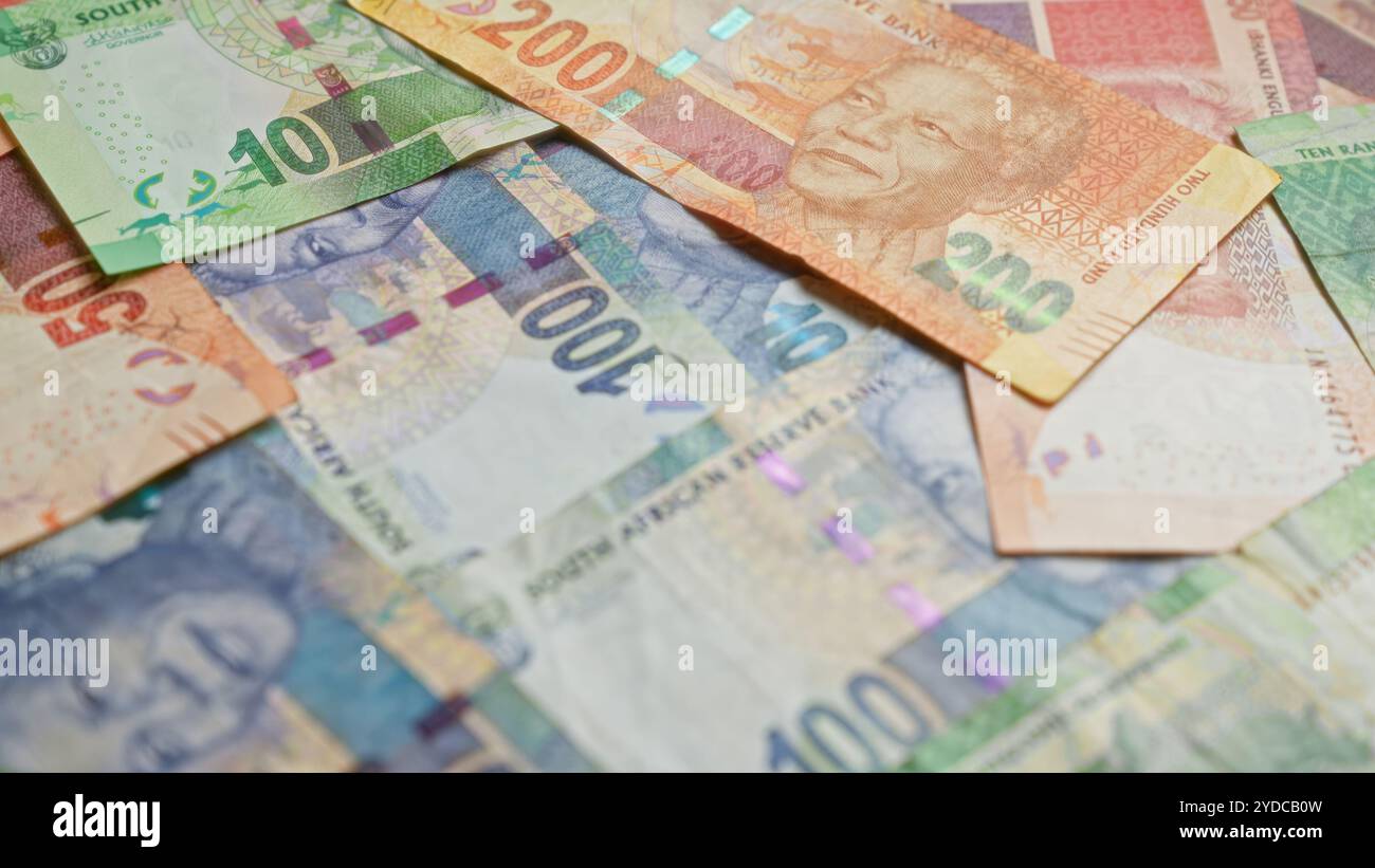 South african banknotes, featuring nelson mandela, scattered closely ...