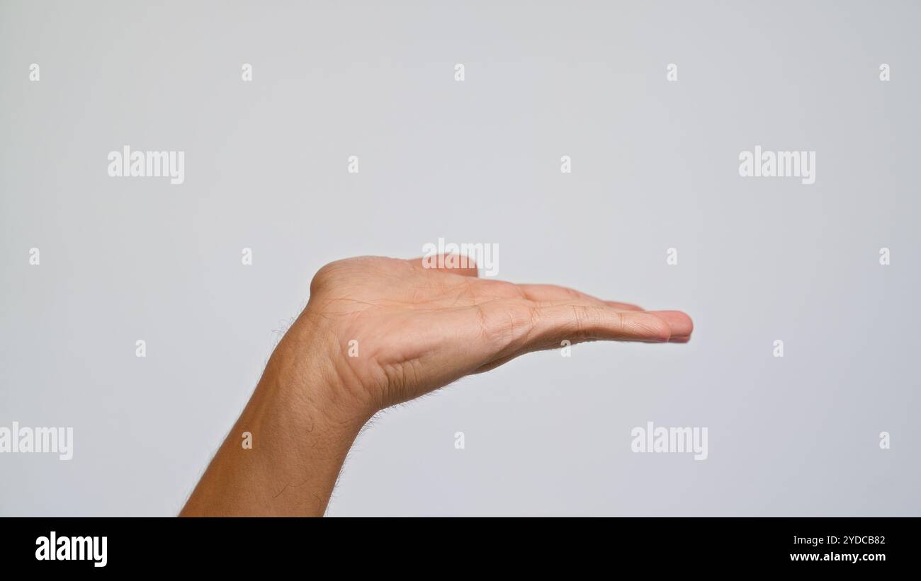 Man's hand with open palm against neutral background showing a gesture ...