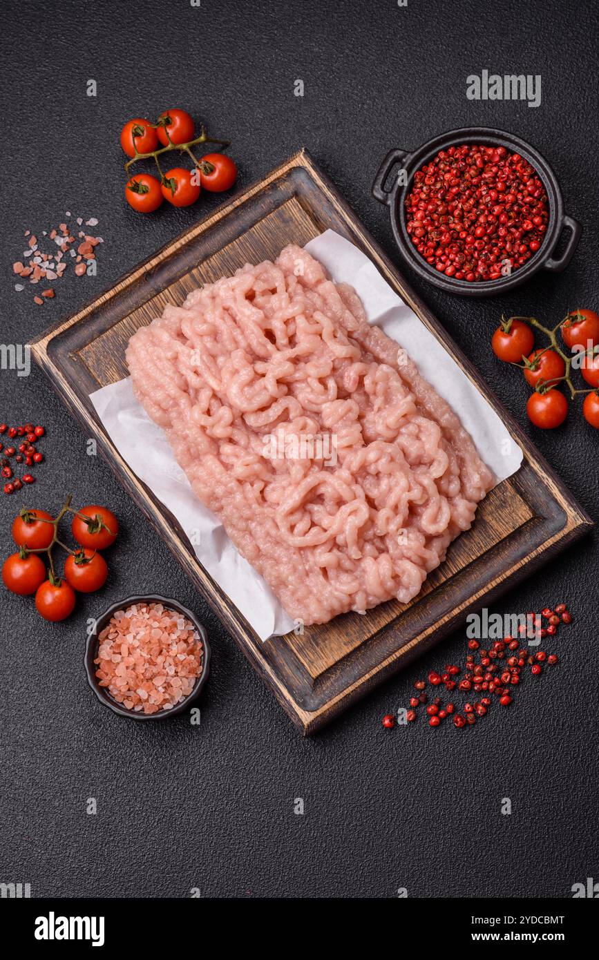 Fresh raw chicken mince with salt and spices Stock Photo - Alamy