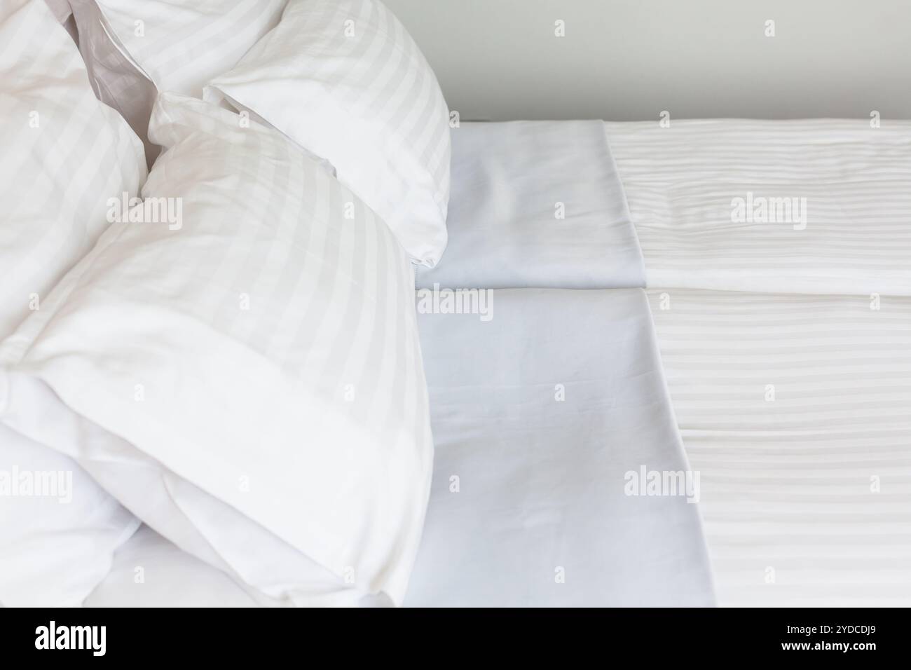 Prepared fresh bed, scene in hotel room Stock Photo - Alamy