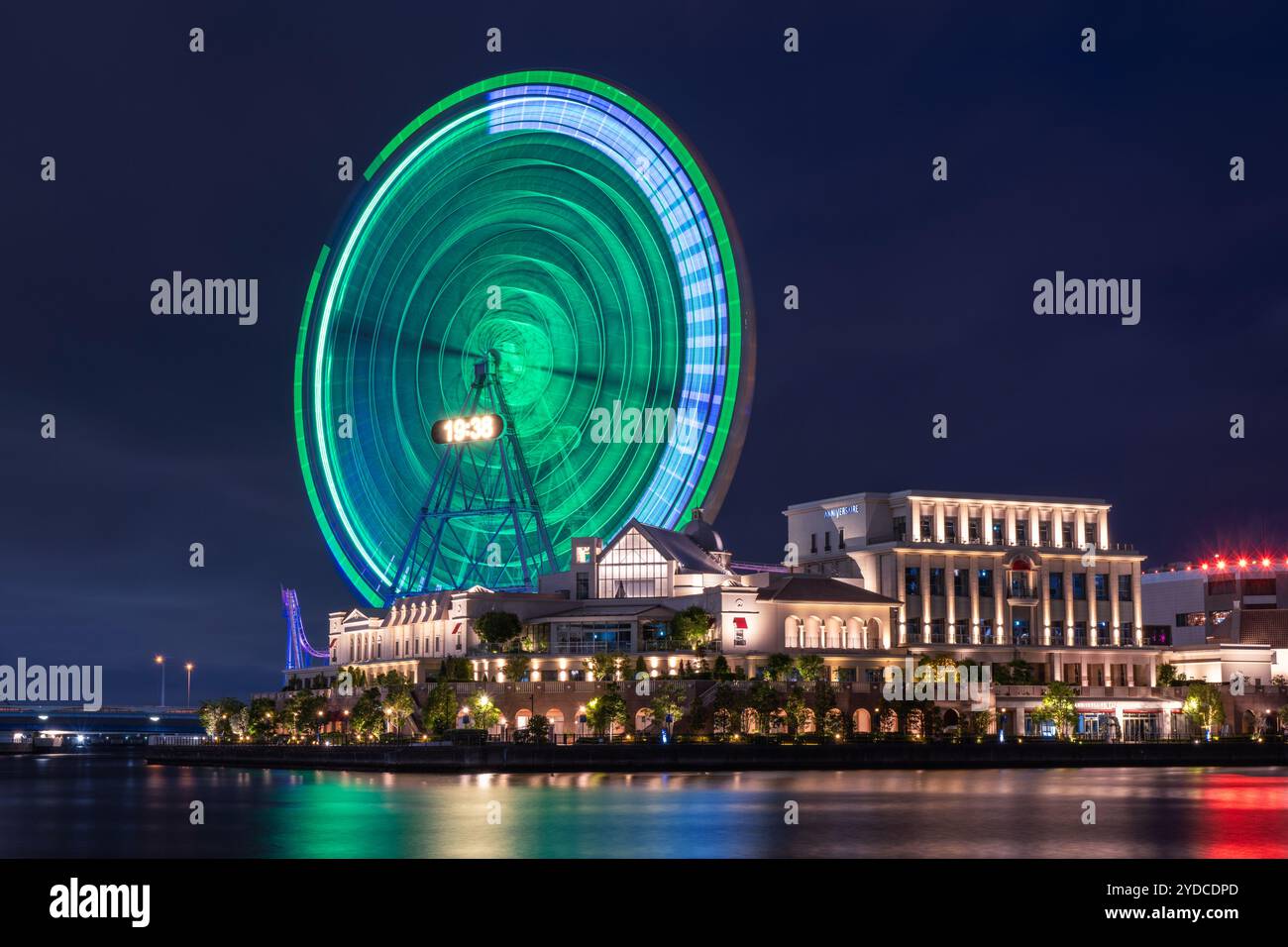 This is a night view of the Cosmo Clock 21, a famous ferris wheel in ...