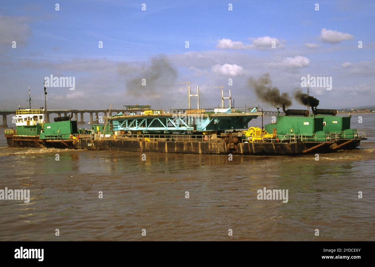 Sar-3 barge taking a road deck section out to be lifted into position ...