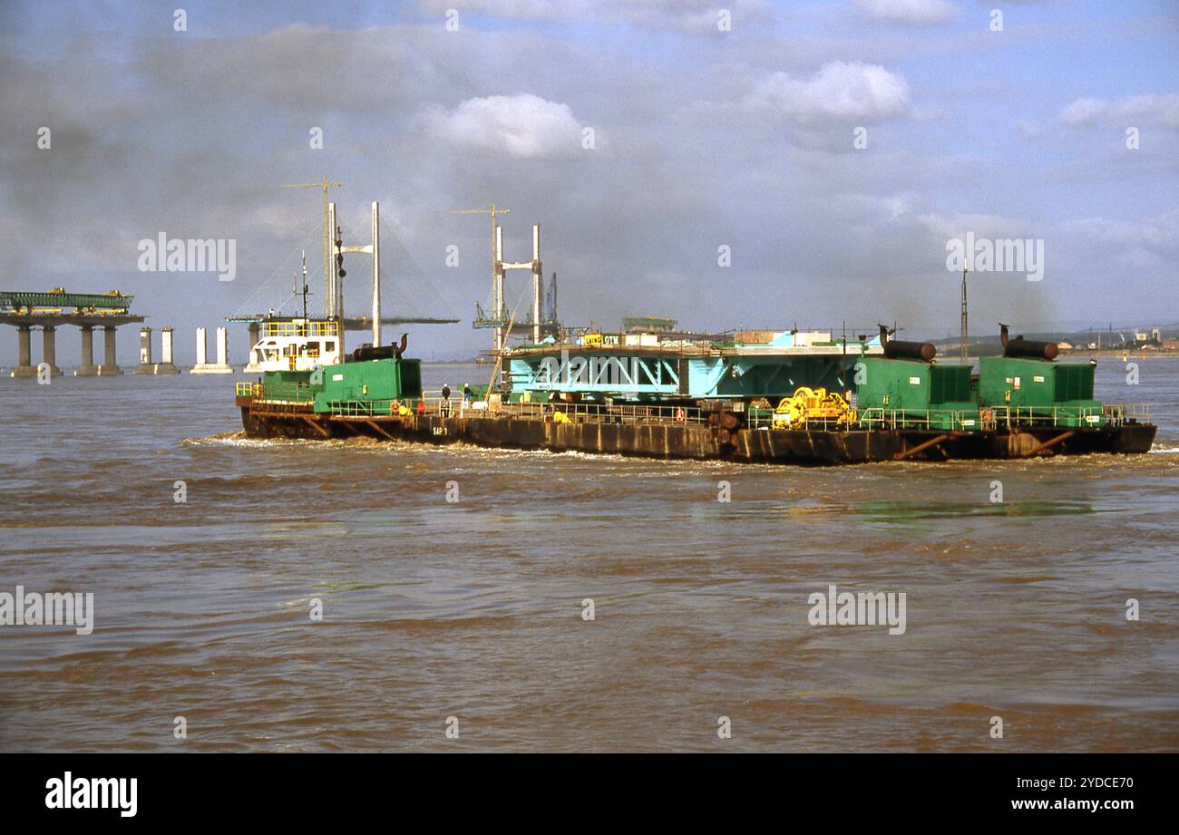 Sar-3 barge taking a road deck section out to be lifted into position ...