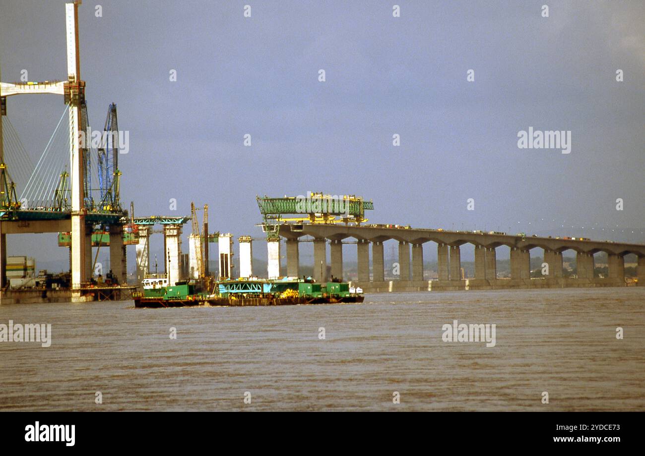 The Sar-3 barge approaching the cable stay concrete towers with a road ...