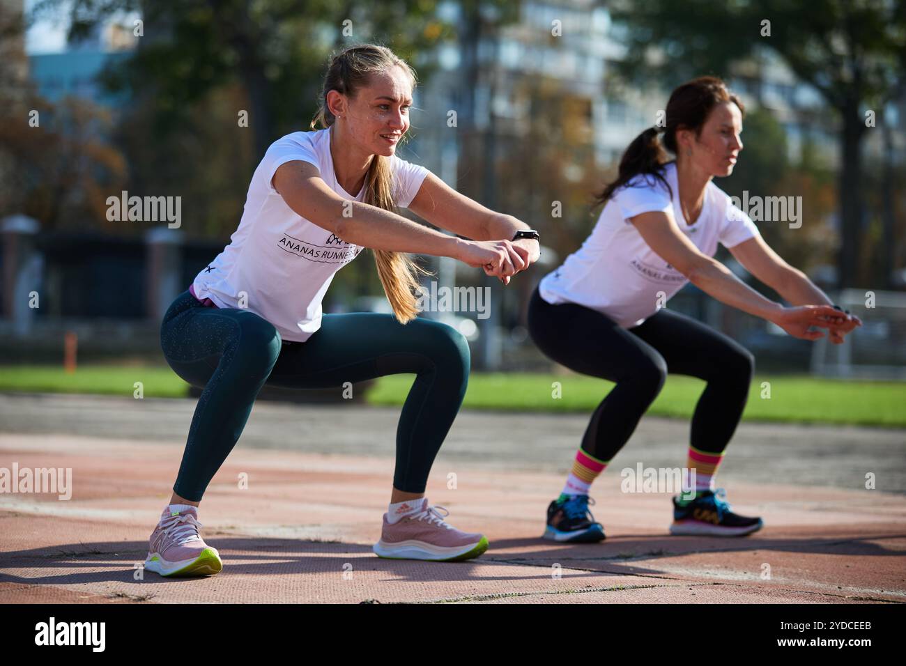 Women doing low squat exercise. Isometric exercises for strong leg ...