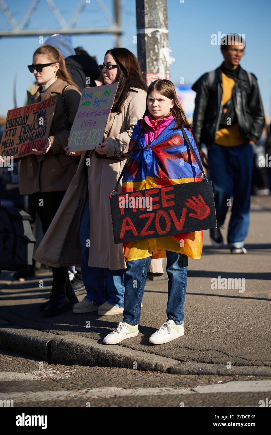 Ukrainian girl demonstrating with a poster "Free Azov" on a public ...