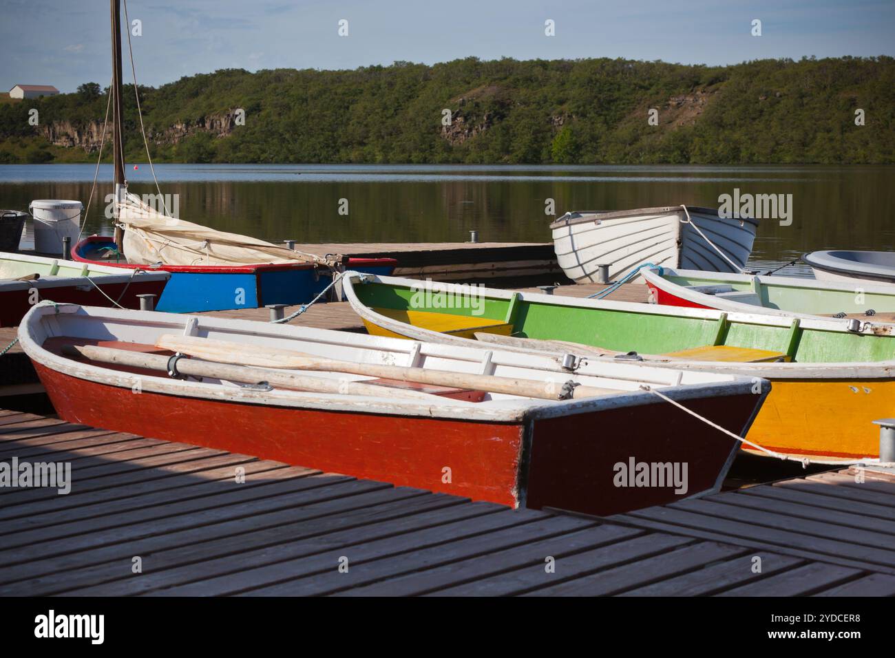 Color Wooden Boats with Paddles in a Lake Stock Photo - Alamy