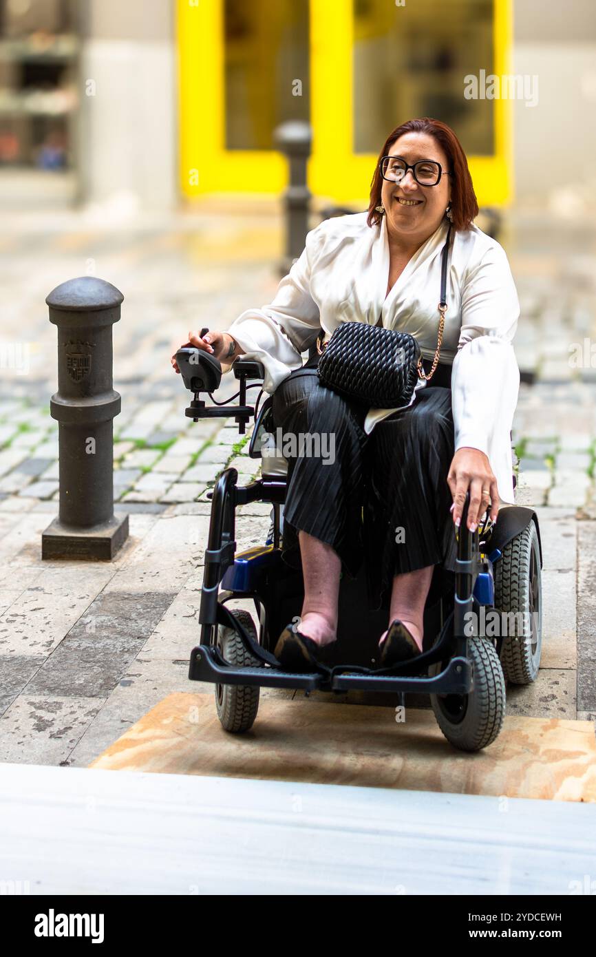 Wheelchair User Accessing Store with Wooden Ramp in Urban Area Stock ...