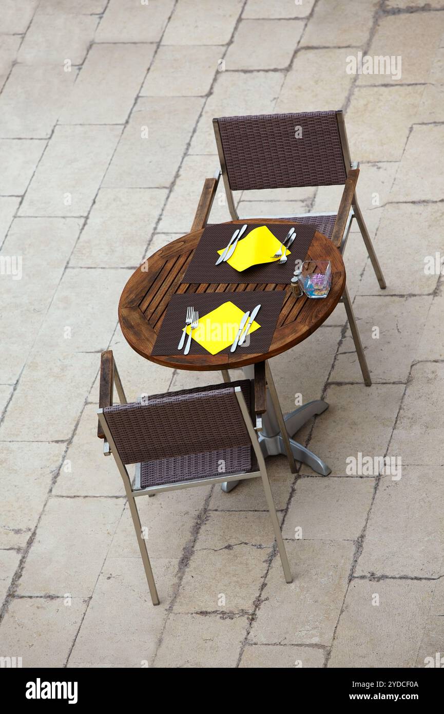 Outdoor summer cafe tables with chairs Stock Photo - Alamy