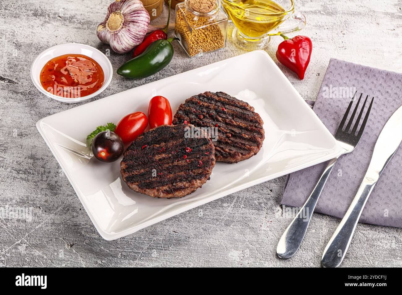Grilled beef burger cutlet with sauce Stock Photo - Alamy