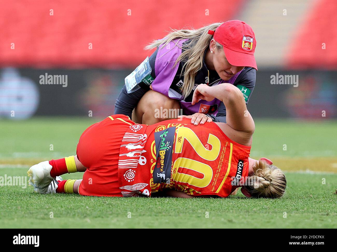 Gold Coast, Australia. 26th Oct, 2024. Daisy D'Arcy of the Suns suffers ...