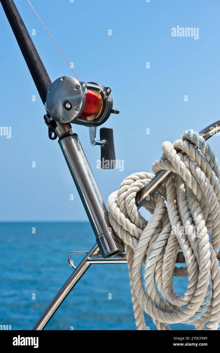 Fishing rod and reel on a yacht Stock Photo - Alamy