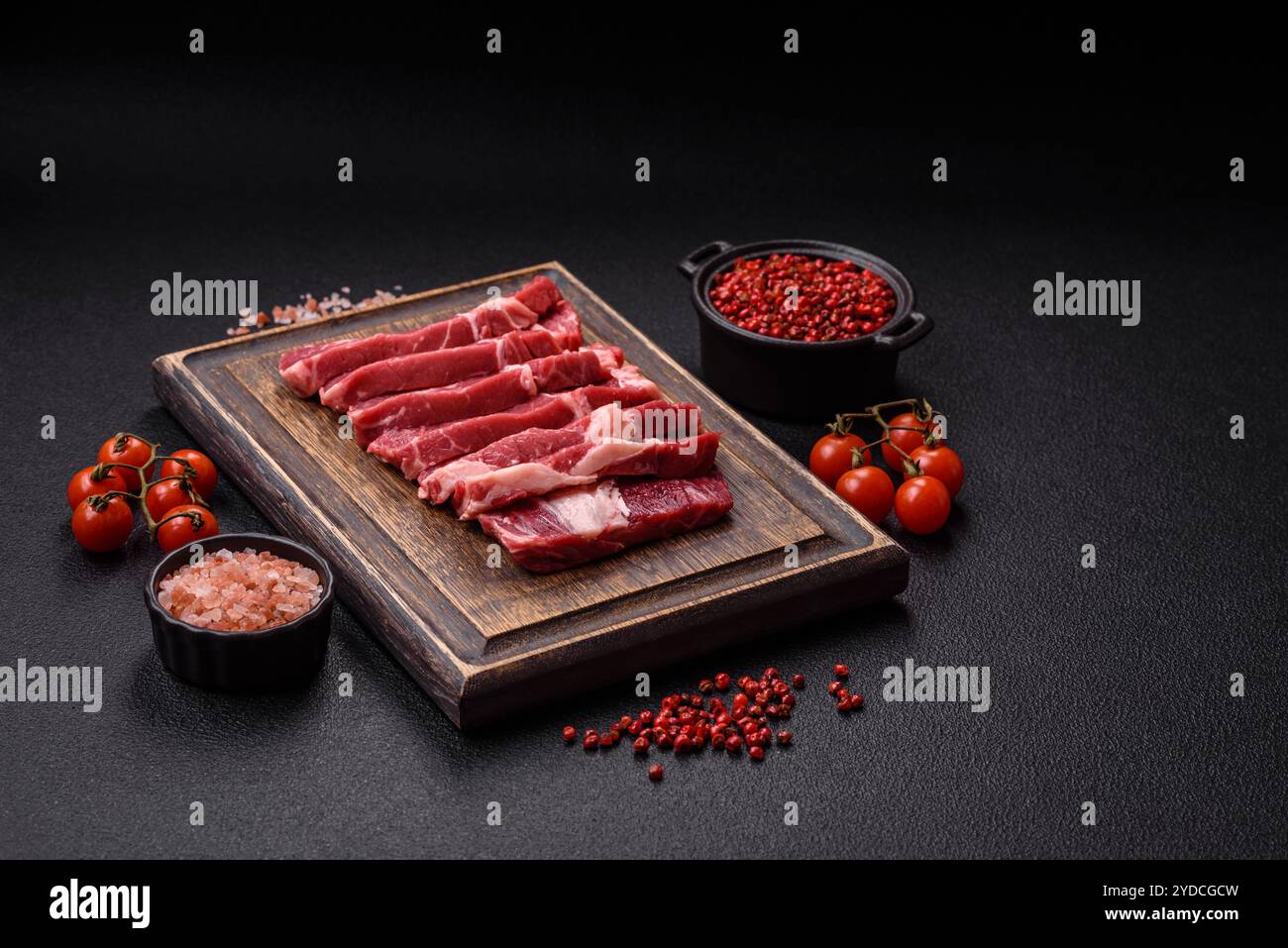Fresh raw beef cut into slices with salt, spices Stock Photo - Alamy