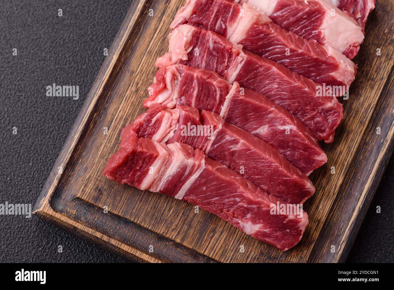 Fresh raw beef cut into slices with salt, spices Stock Photo - Alamy