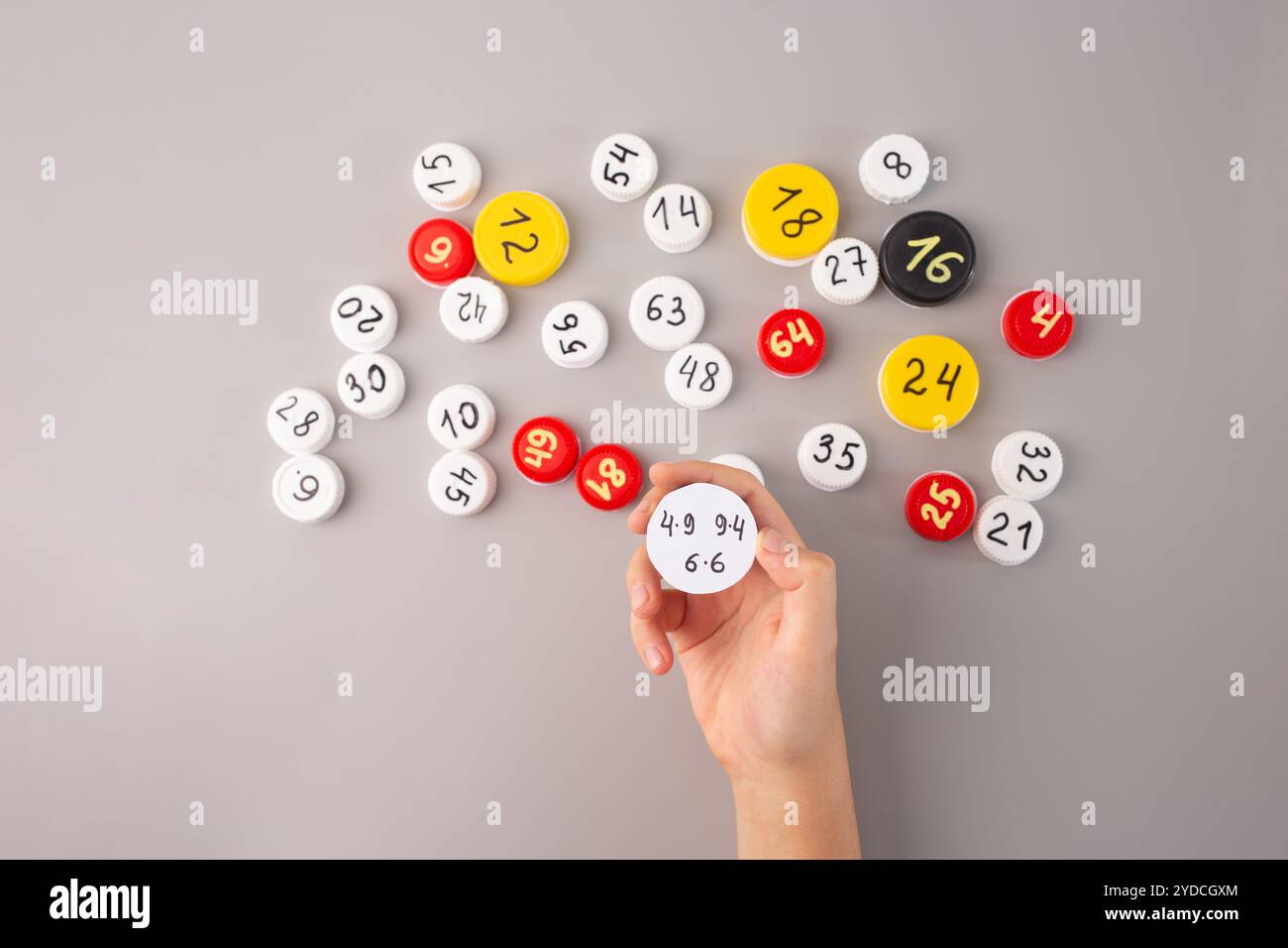 Mathematics activity for kids with bottle caps numbered with ...