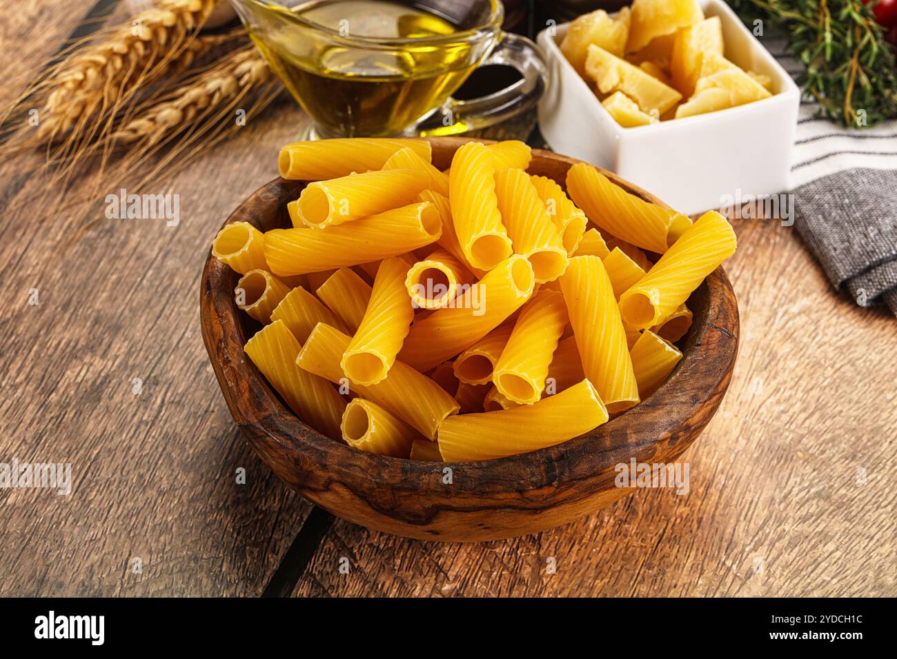 Italian cuisine - raw dry tortiglioni pasta Stock Photo - Alamy