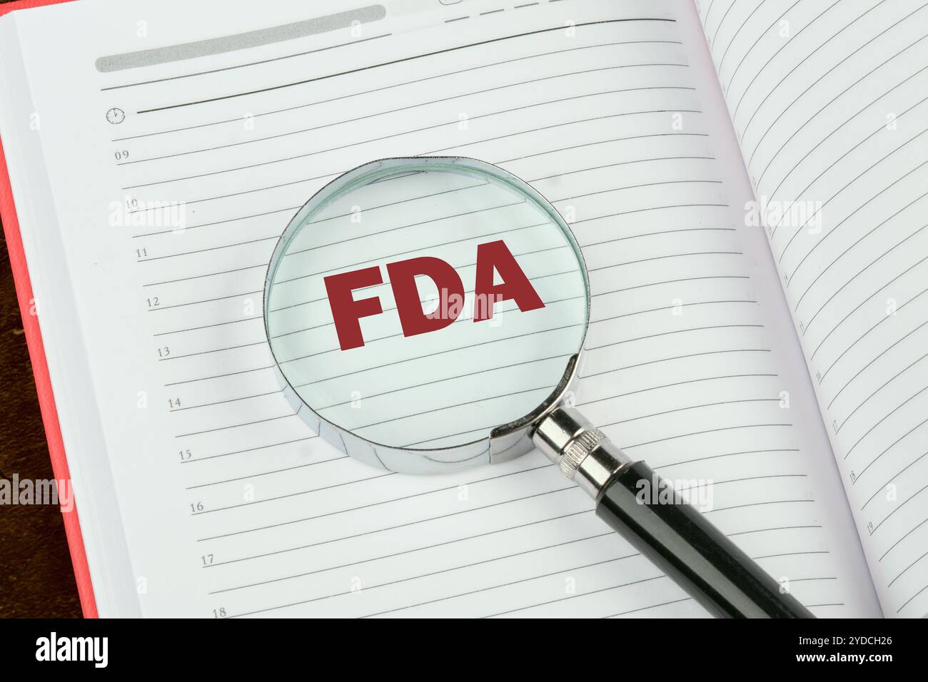 FDA, words on wooden blocks. Business concept,FDA written in a notebook ...