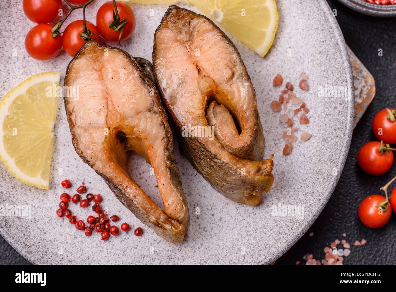 Delicious red salmon r trout fish grilled with spices and herbs Stock ...