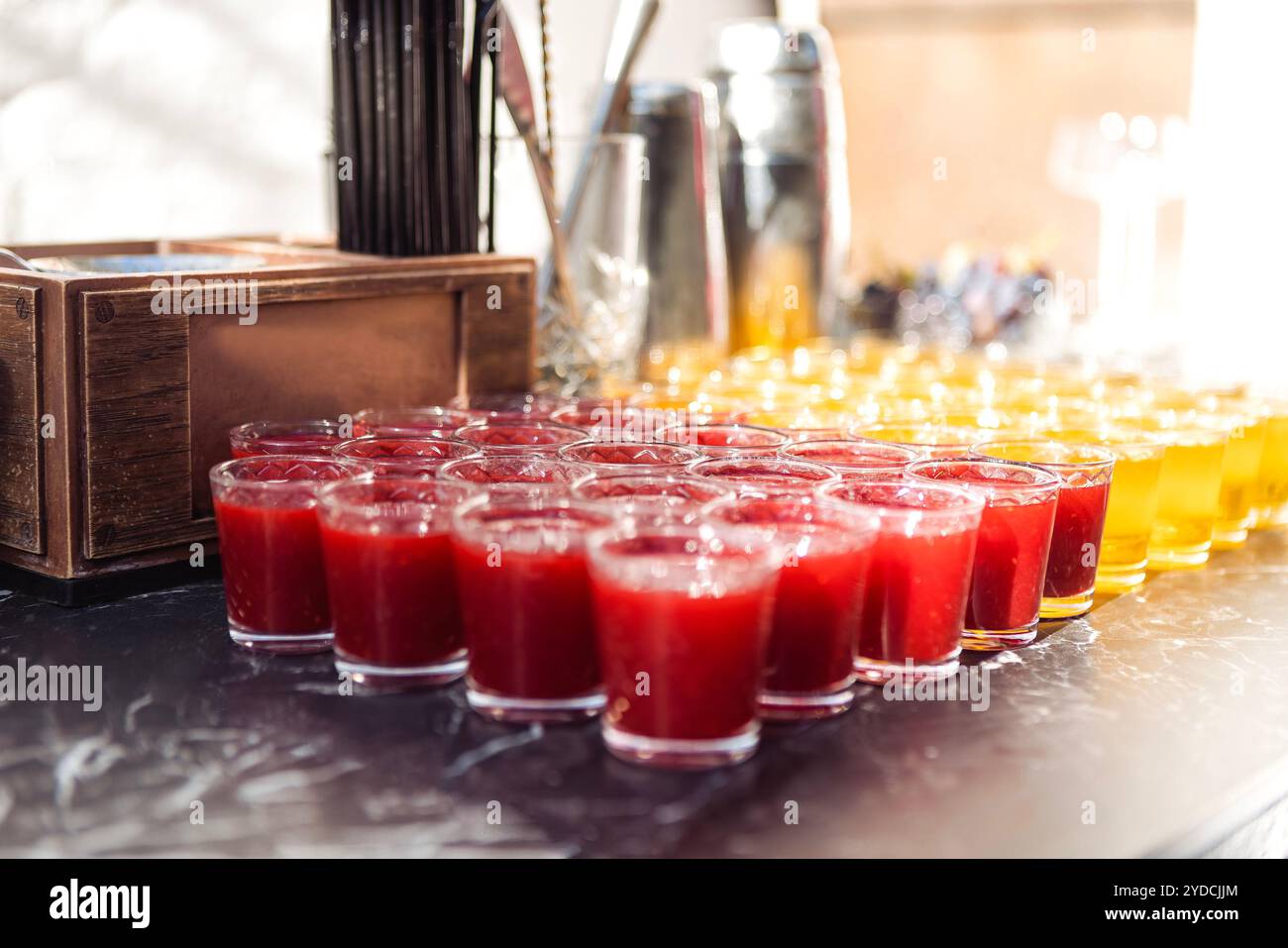 Smooth rows of glasses with delicious refreshing berry and fruit drinks ...
