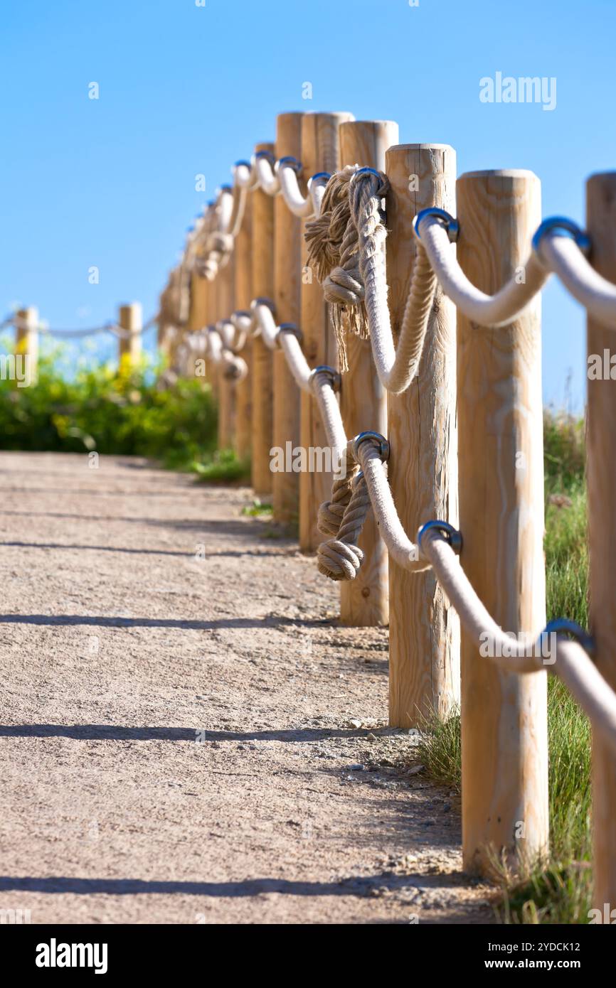 Pathway with wood post fence Stock Photo - Alamy
