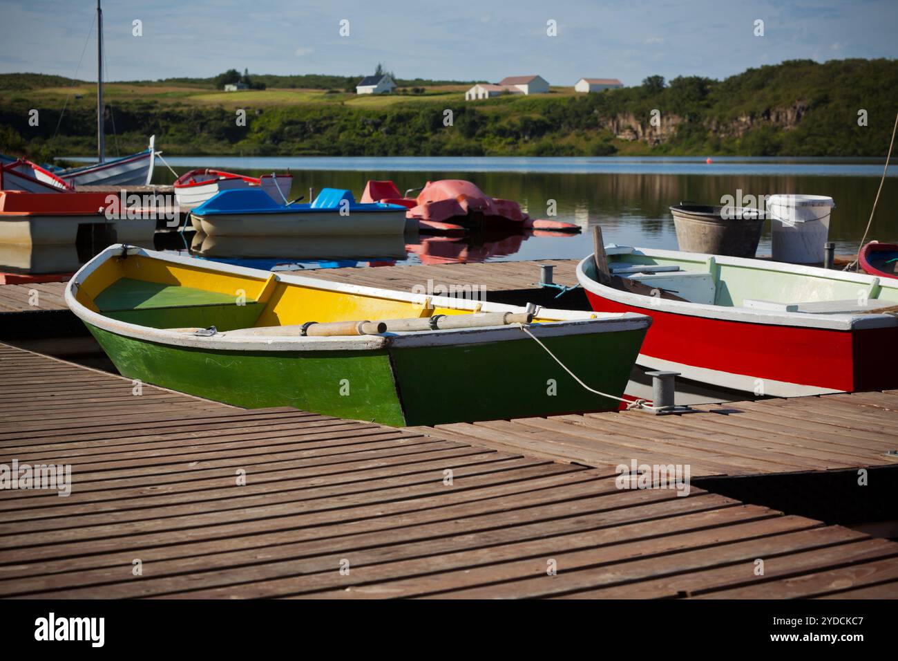 Color Wooden Boats with Paddles in a Lake Stock Photo - Alamy