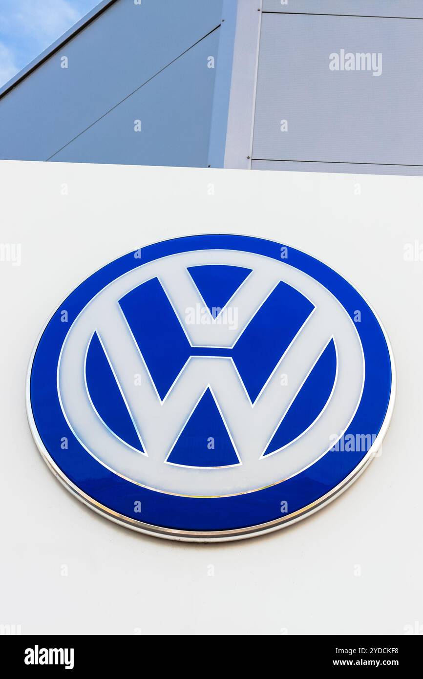 Volkswagen brand logo on blue sky background Stock Photo - Alamy