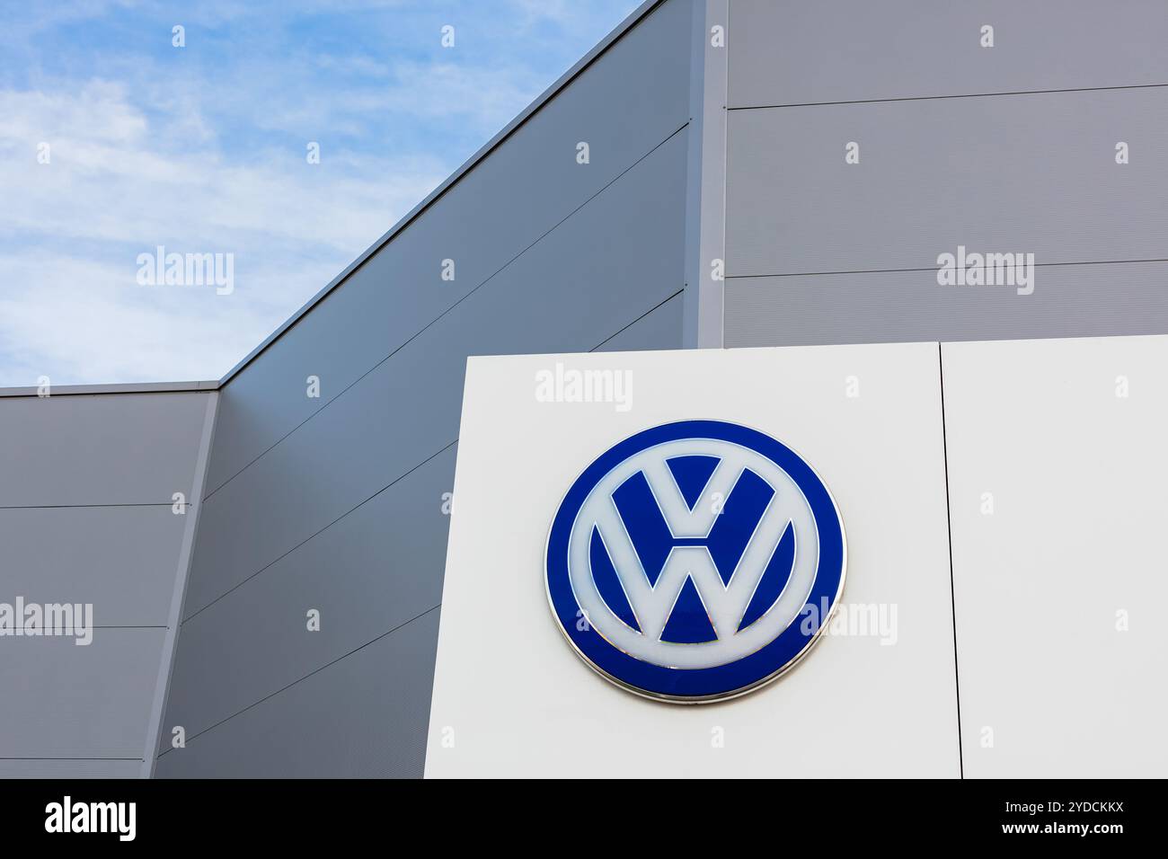 Volkswagen brand logo on blue sky background Stock Photo - Alamy