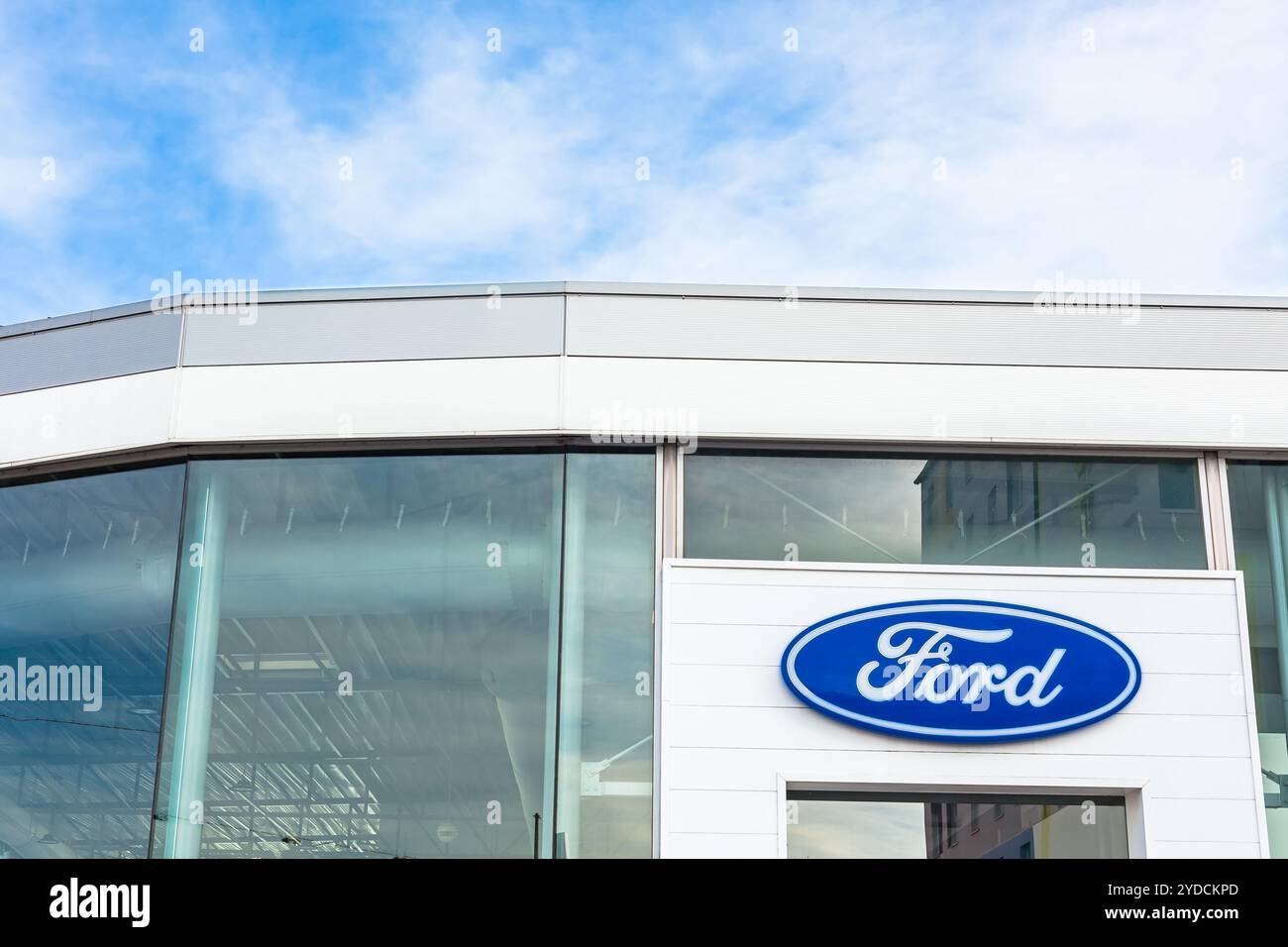 Ford brand logo on bright blue sky background Stock Photo - Alamy