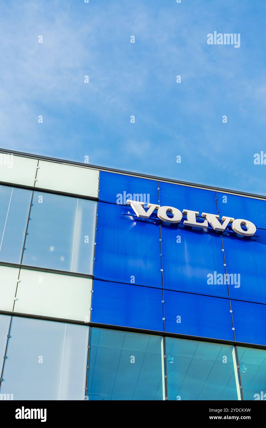 Volvo brand logo on bright blue sky background Stock Photo - Alamy