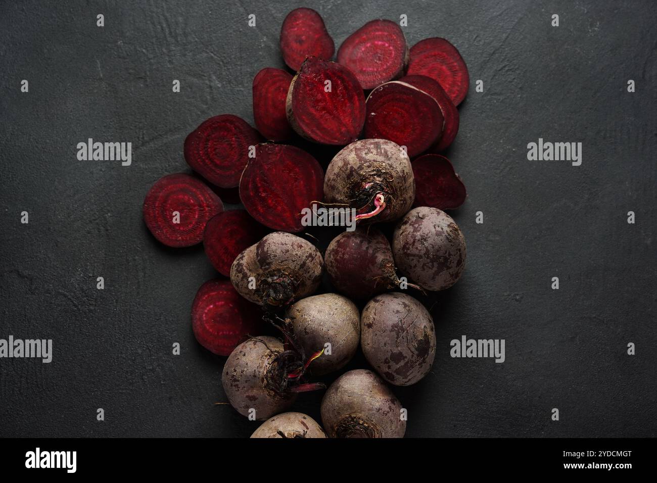 Beetroot cut on dark table.Sliced beetroot on black kitchen table Stock ...