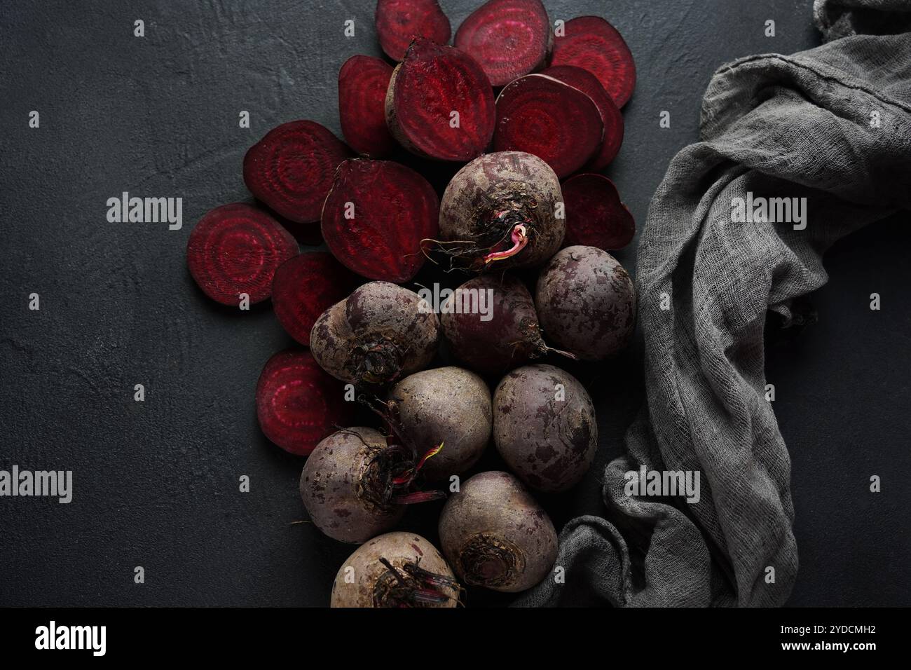 Beetroot cut on dark table.Sliced beetroot on black kitchen table Stock ...