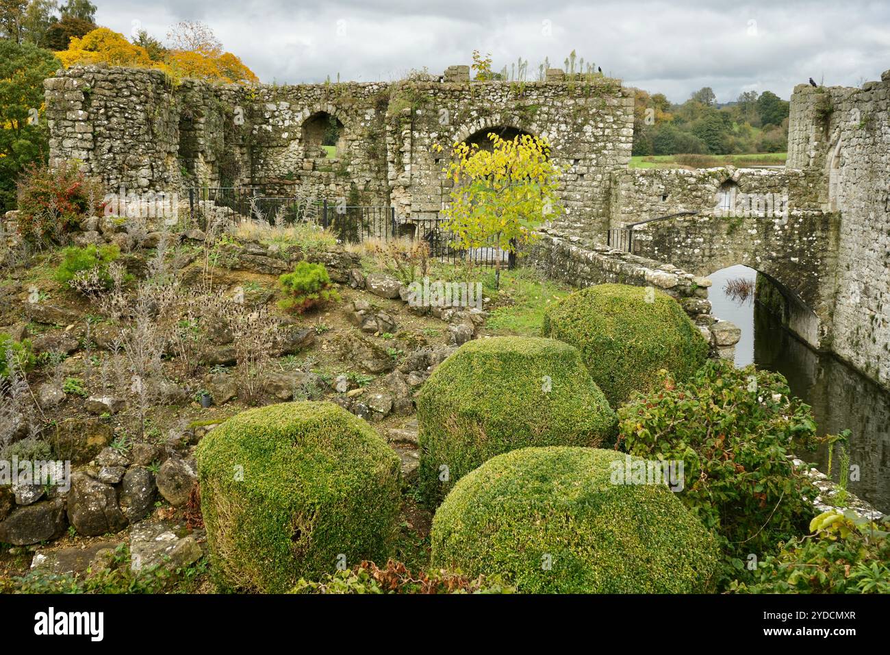 Ruins of The Medieval Barbican and Mill at Leeds castle under a grey ...