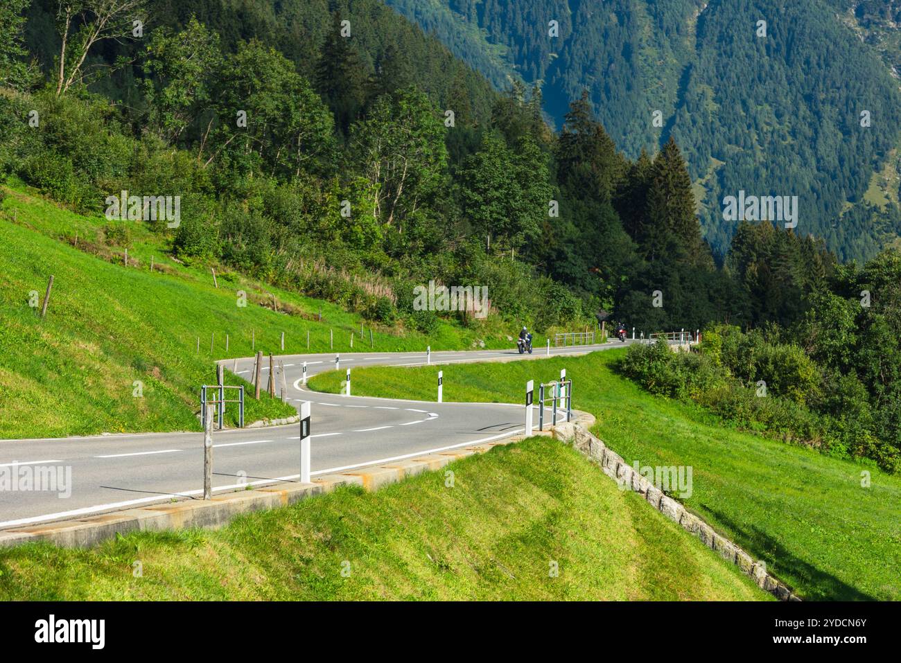 Road Turn in Mountains Stock Photo - Alamy