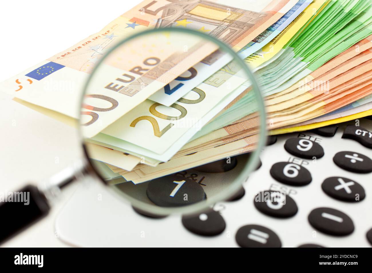 Euro Notes with calculator and magnifier Stock Photo - Alamy