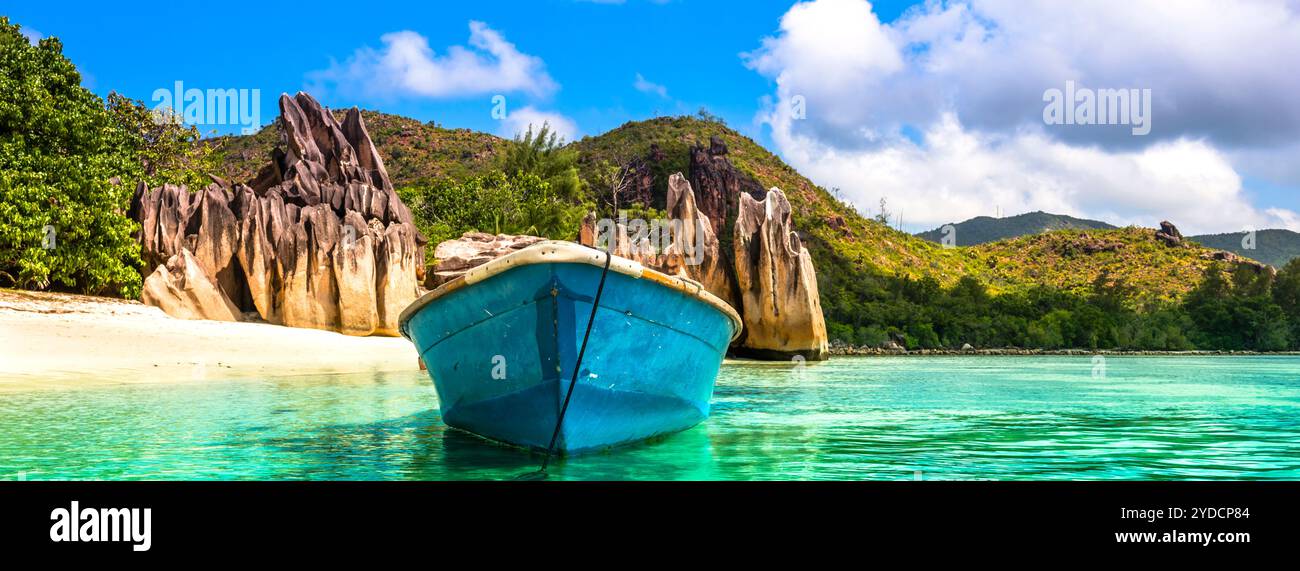 Old fishing boat on Tropical beach at Curieuse island Seychelles Stock ...
